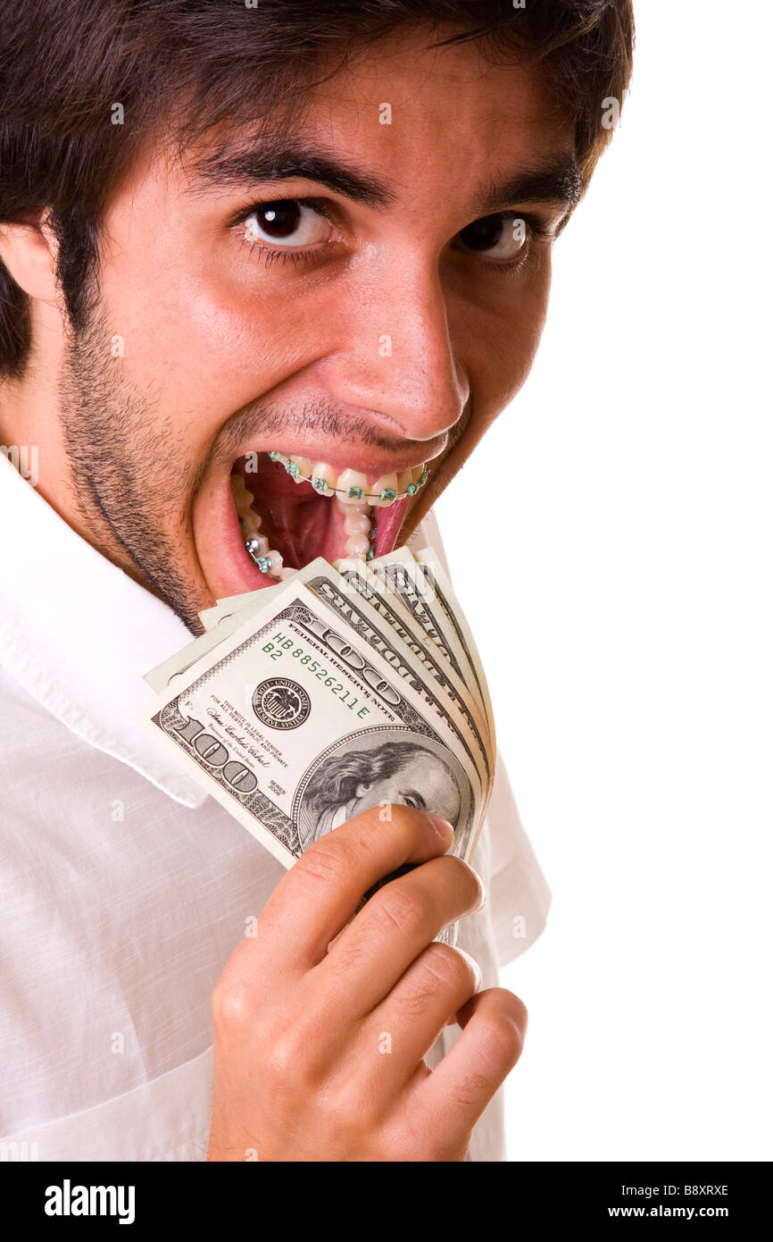 mouth with braces on the teeth eating money isolated on withe Stock ...