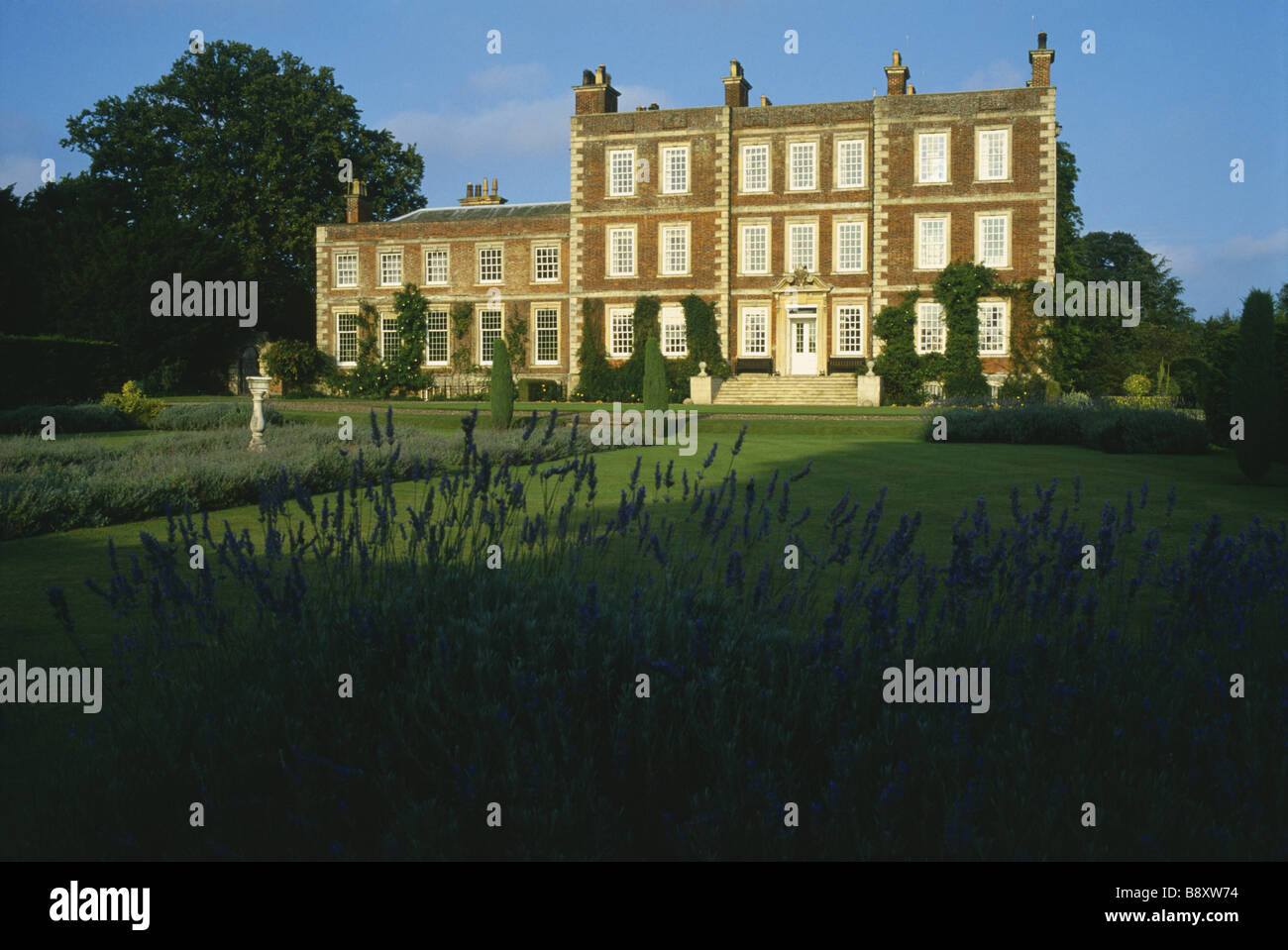 View of the front entrance of Gunby Hall with lawns and lavender beds ...