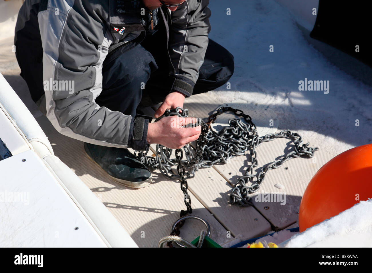 man checking anchor system Stock Photo - Alamy