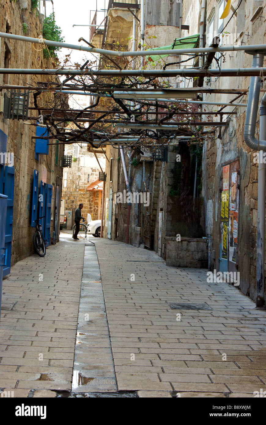 Narrow stone masonry paved pedestrian bike passageway in fortress port ...
