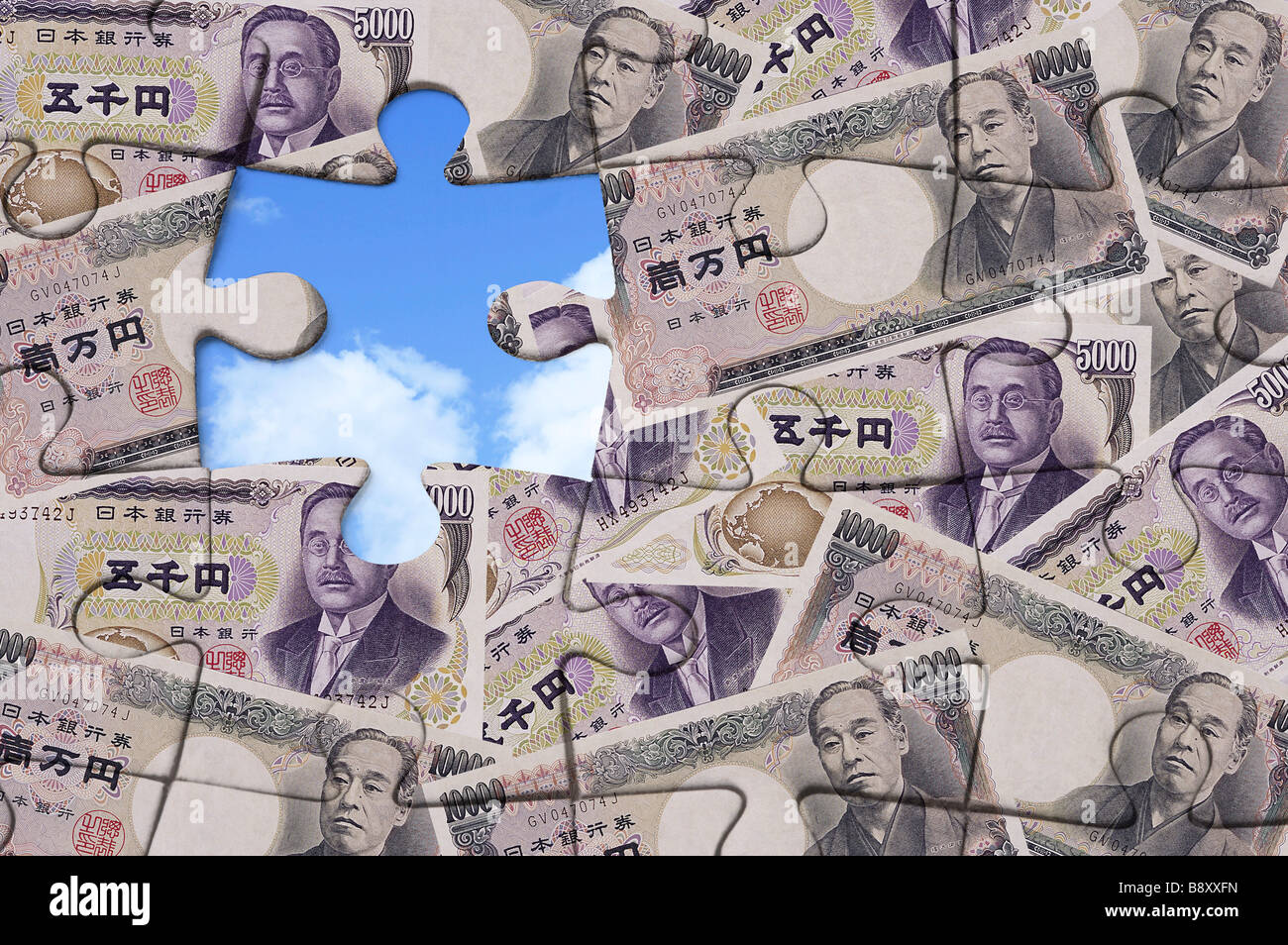 A puzzle of Yen paper money design revealing clear sky Stock Photo - Alamy