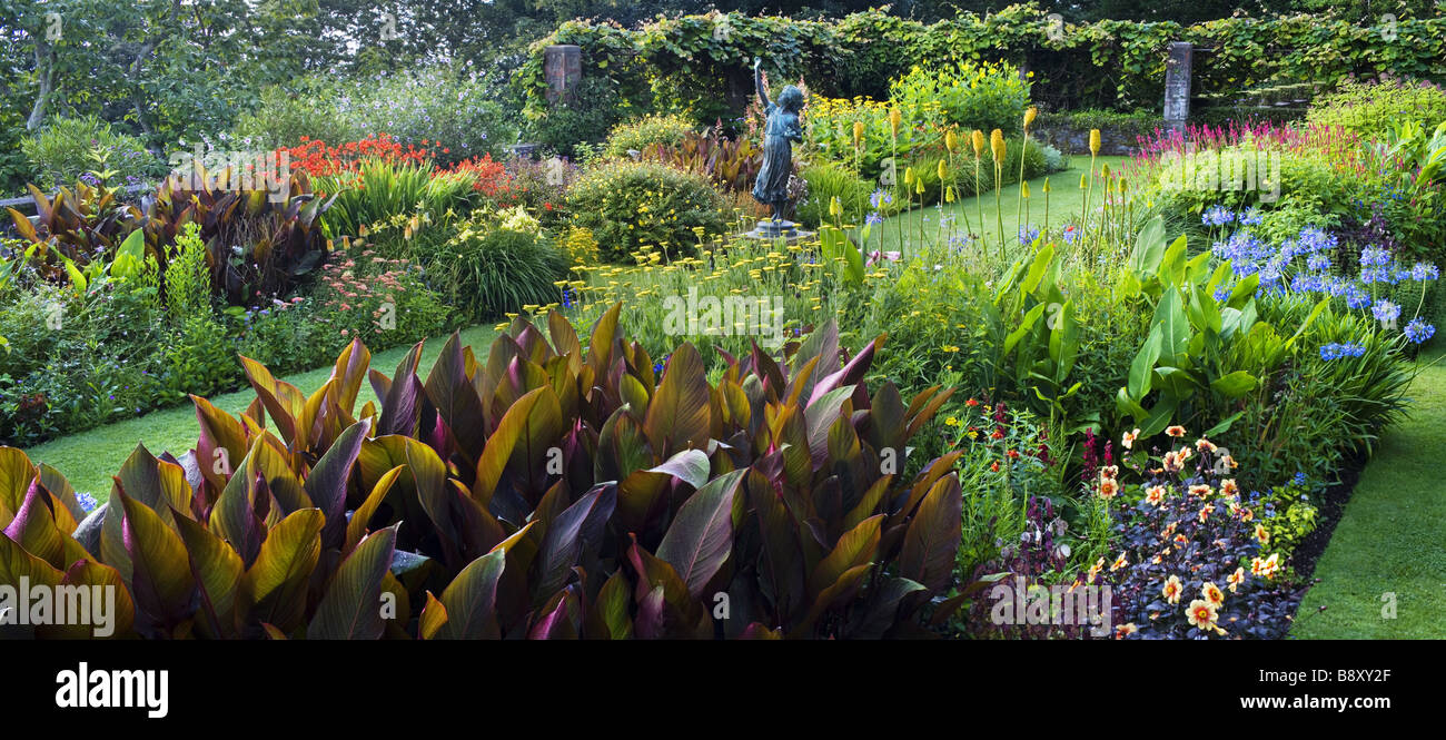 Herbaceous borders and First Flight a bronze statue by Albert Bruce Joy ...