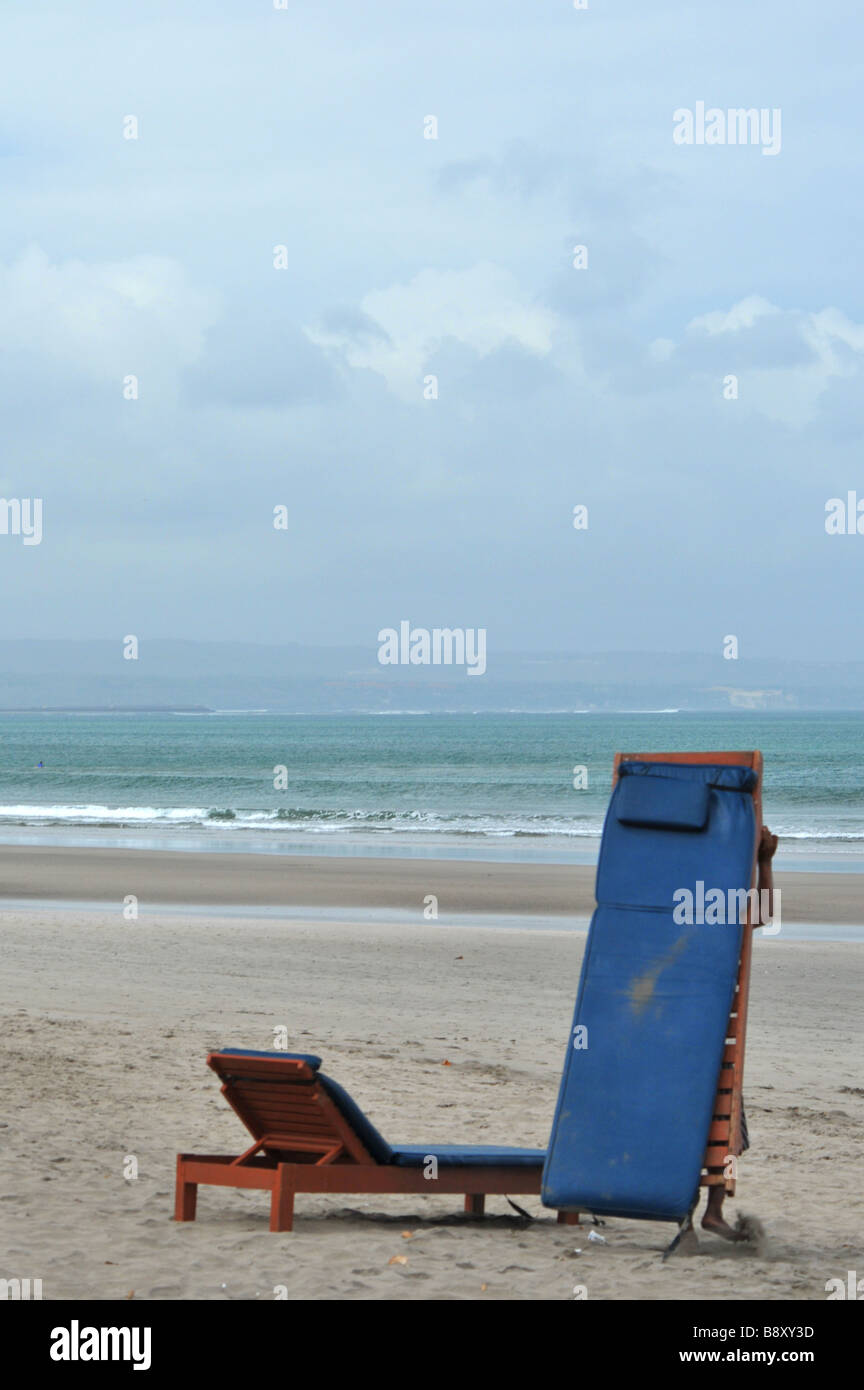 Beach boy carrying sunbathing chair to the beach for rent,Legian beach ...