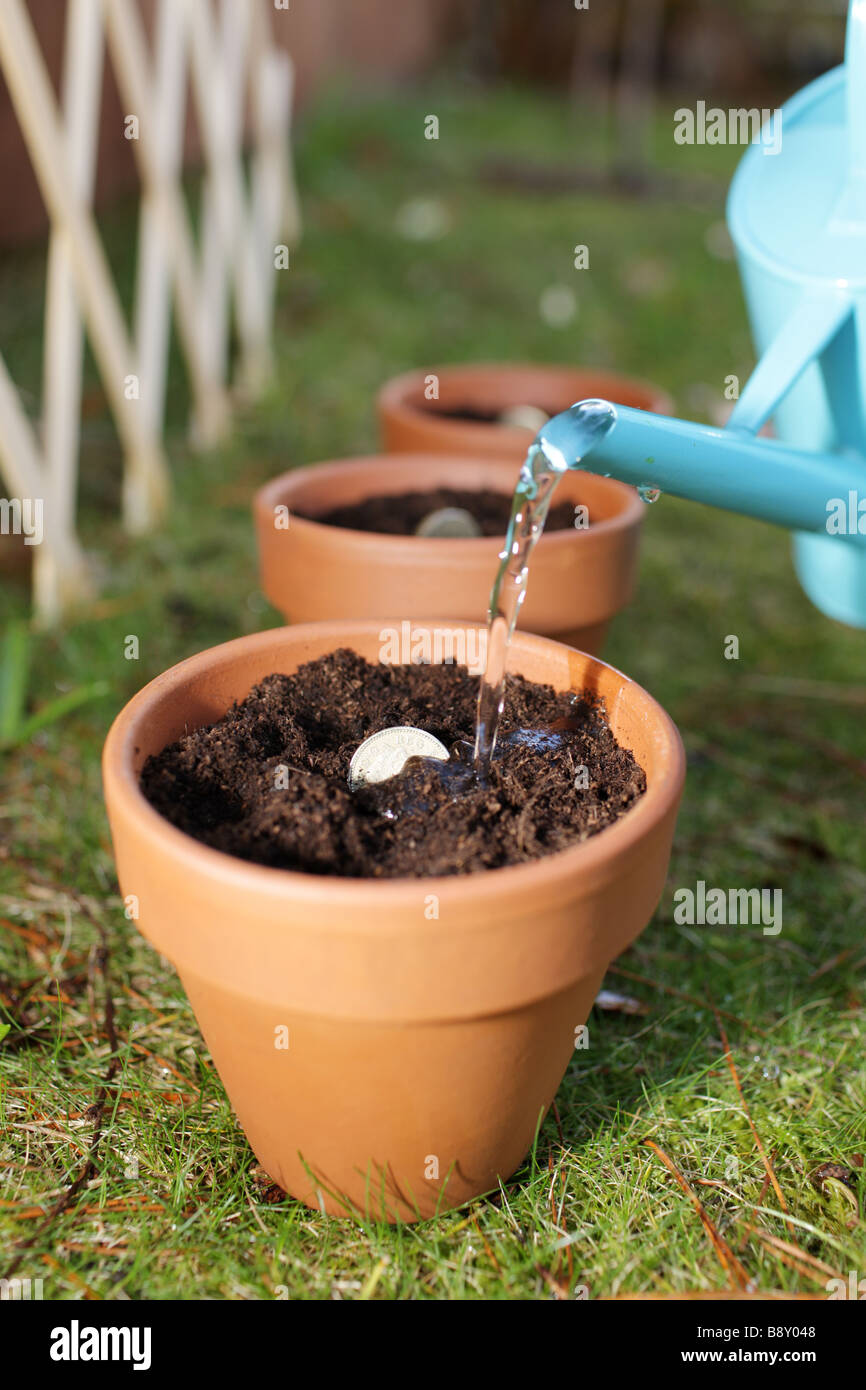 Money in a Pot Stock Photo - Alamy
