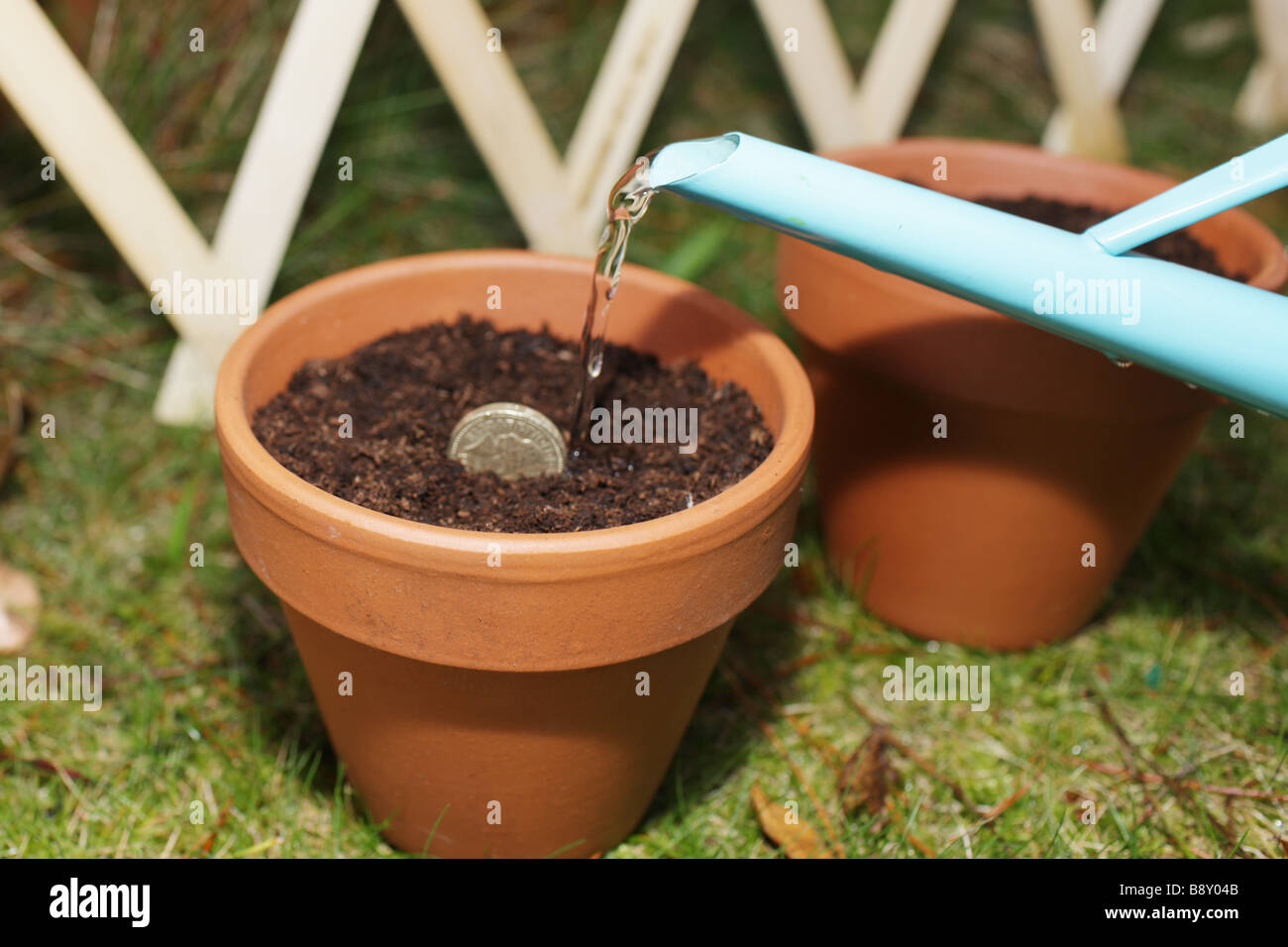 Money in a Pot Stock Photo - Alamy