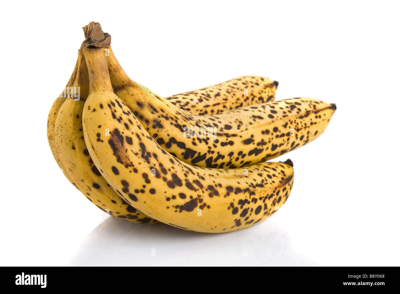 Cluster of over ripe bananas isolated on white background Stock Photo ...