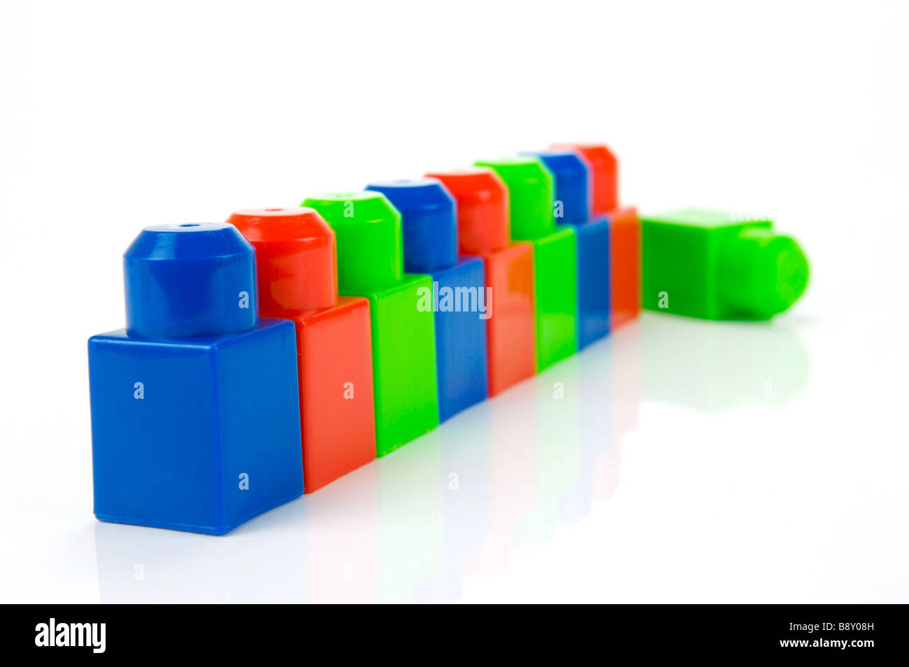 Building blocks isolated against a white background Stock Photo - Alamy
