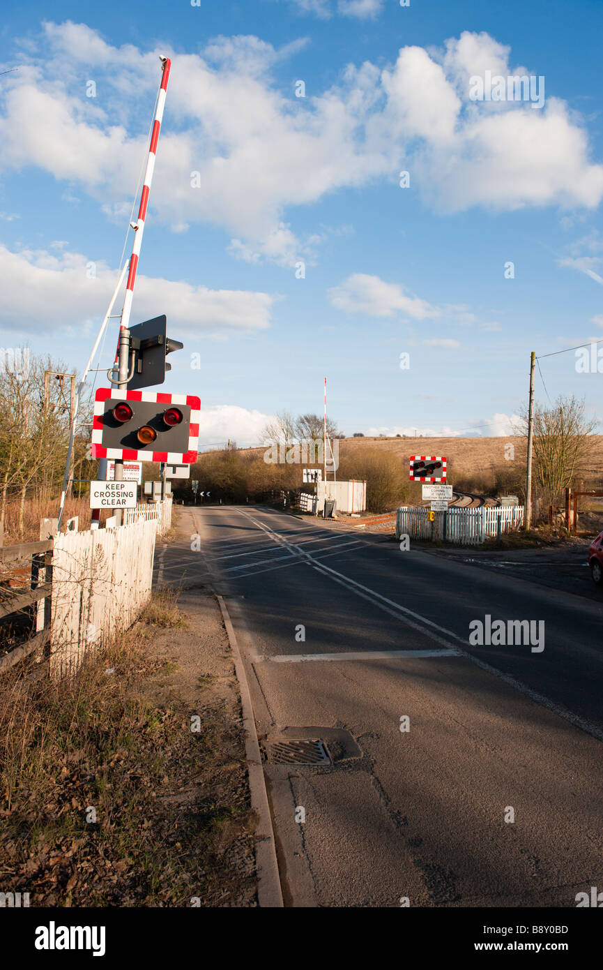 Railway crossing at the junction of a train track and road. Kirkby In ...