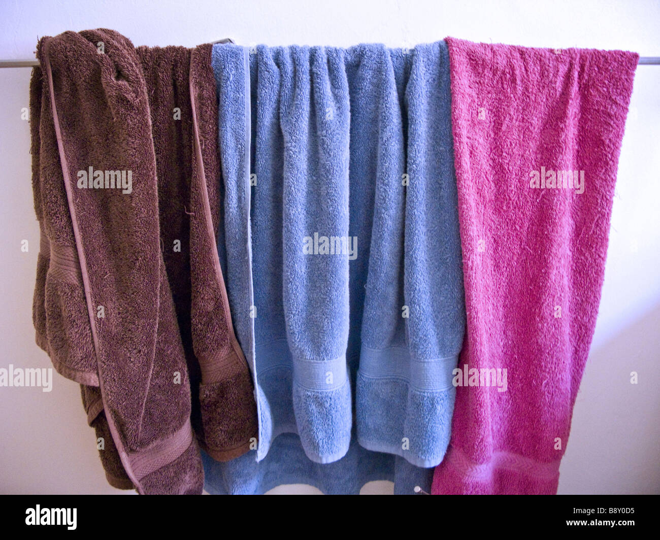 Close-up of three towels hanging on a clothesline Stock Photo - Alamy