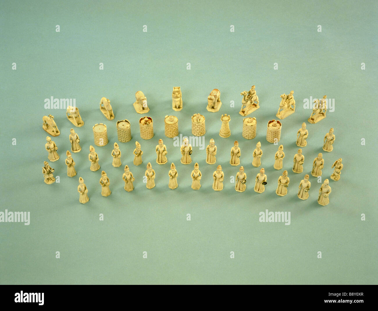 Ivory chess pieces partly stained red and black from two sets in the ...