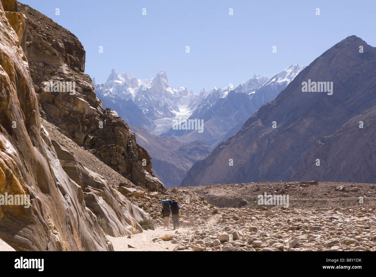 Two people hiking, Baltoro Glacier, Karakoram Range, Baltistan ...