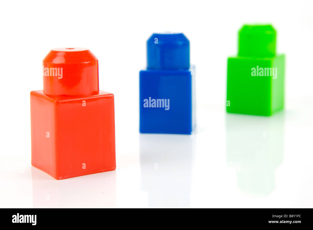 Building blocks isolated against a white background Stock Photo - Alamy