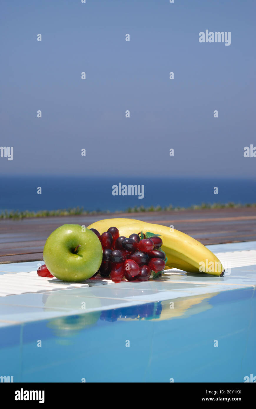 Selection of fruit placed beside the swimming pool Stock Photo - Alamy