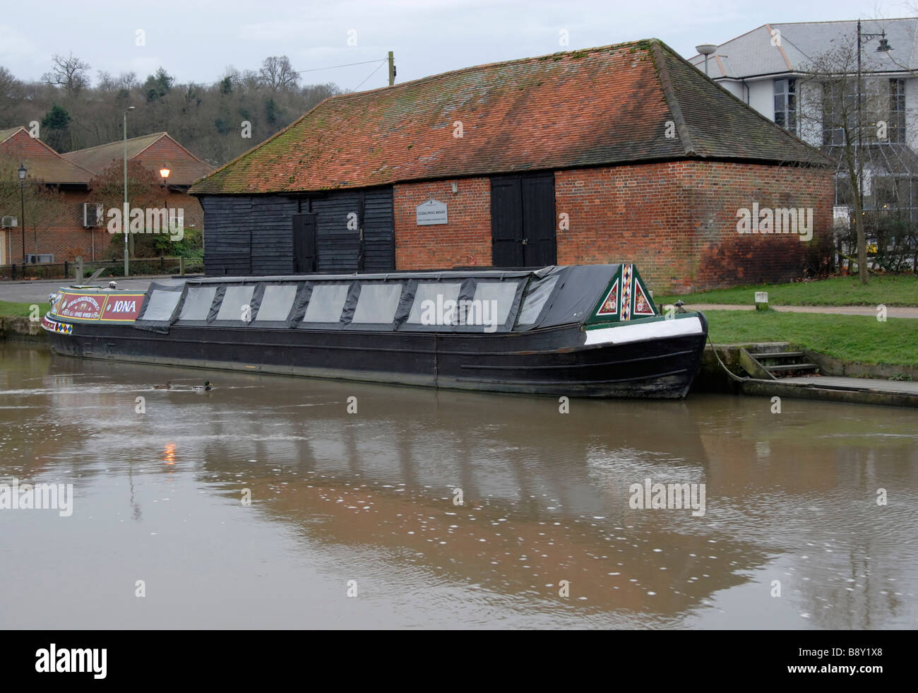 Godalming Wharf with moored traditional horse-drawn day trip narrowboat ...