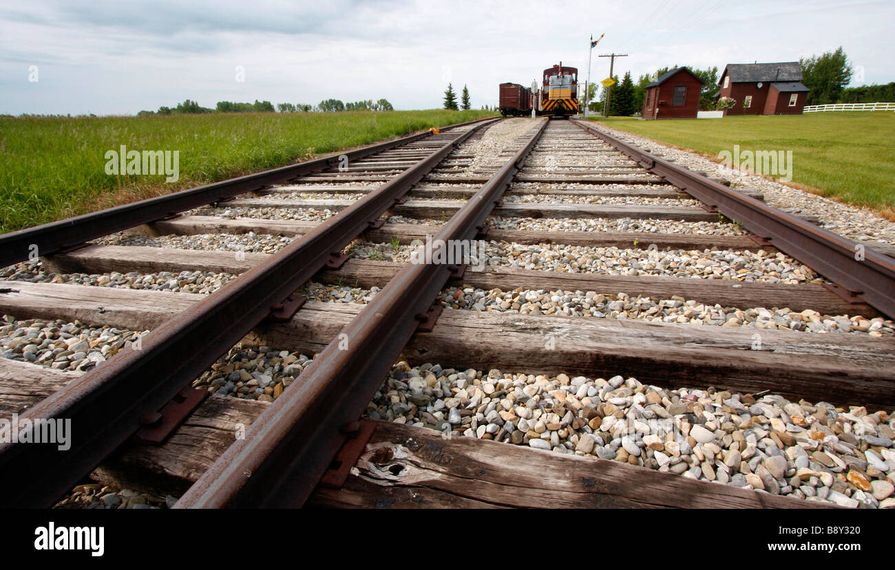 Railroad tracks with trains in the background Stock Photo - Alamy