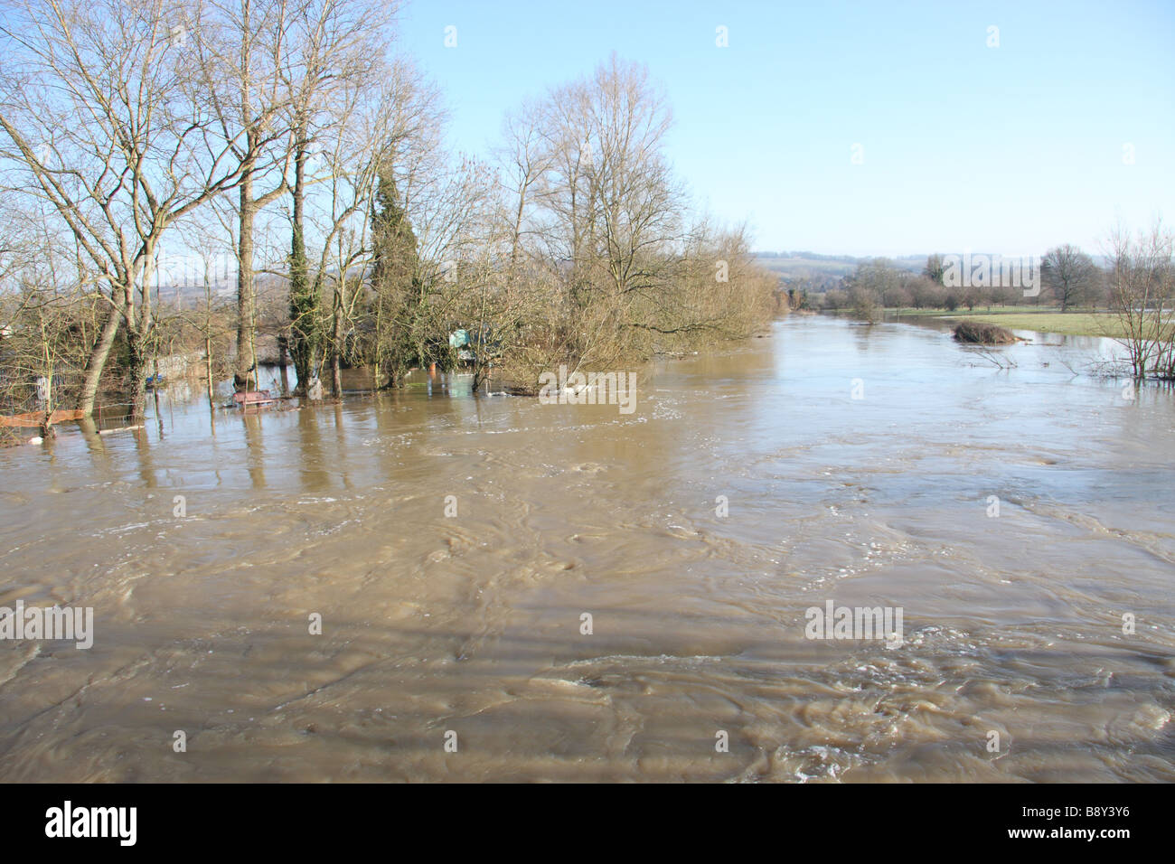 winter tree flood flooding river medway yalding kent uk europe blue ...