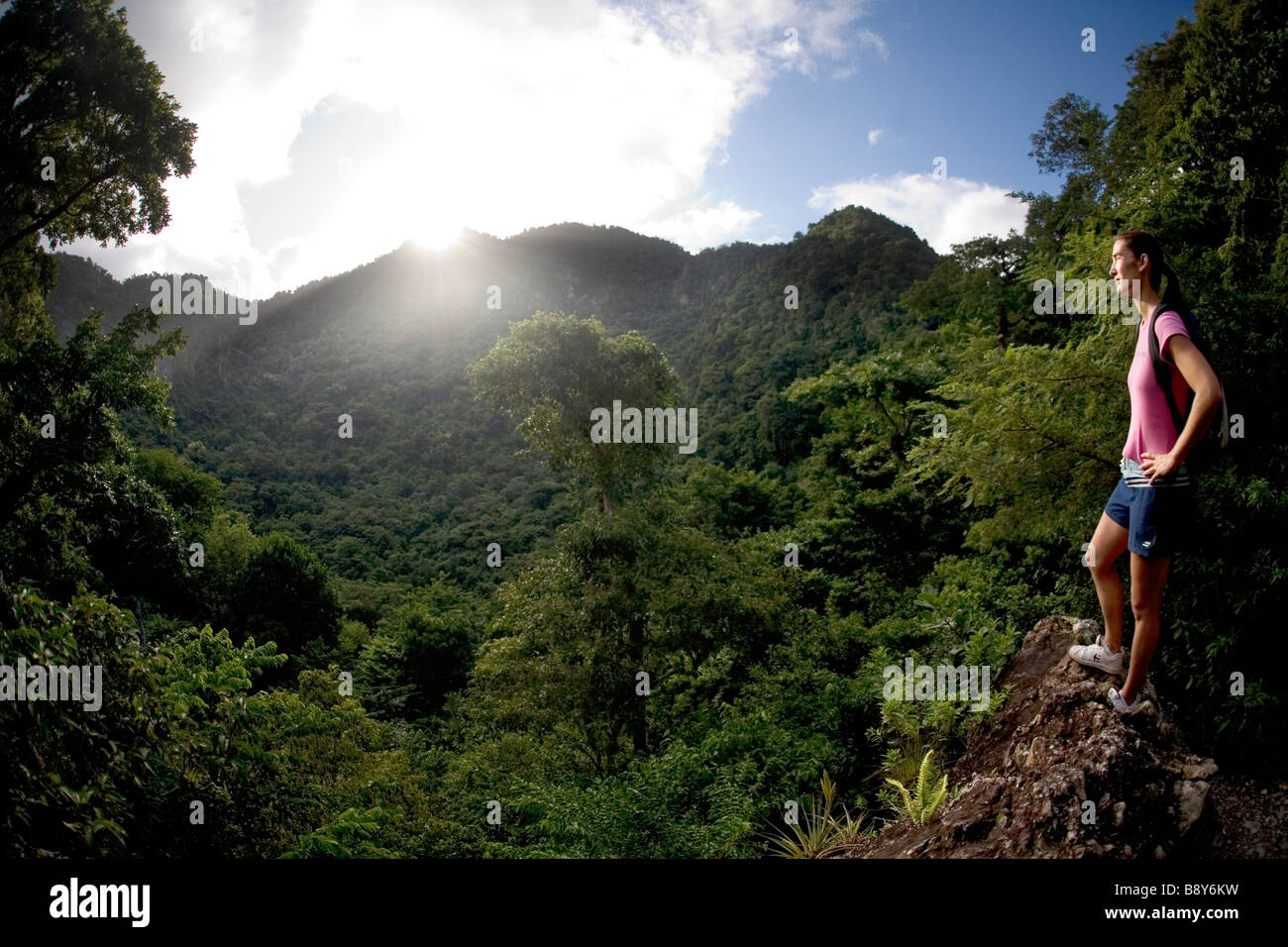 Woman looking at the Quill, a volcano, during sunrise on the Caribbean ...