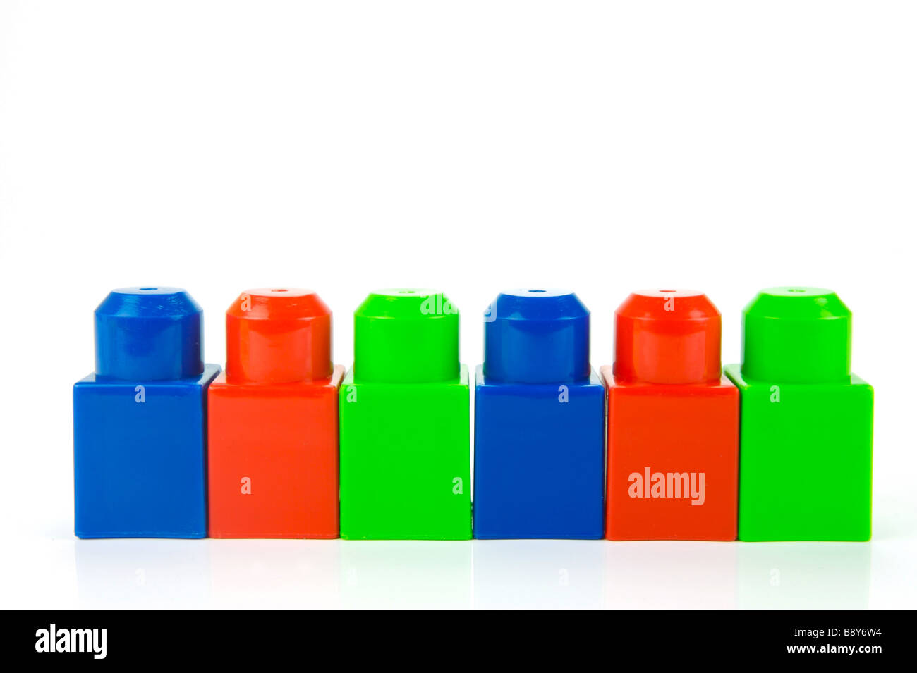 Building blocks isolated against a white background Stock Photo - Alamy
