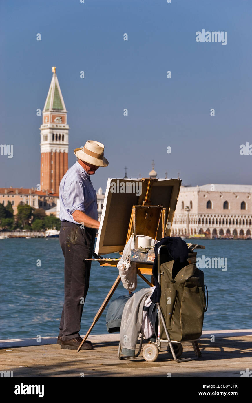 Painter working by the venetian canals, Venice, Italy, Europe Stock ...