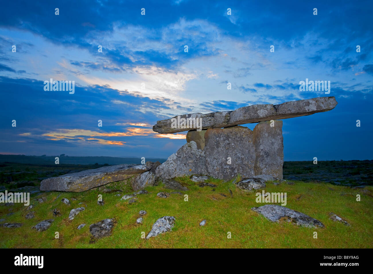 Megalithic stone tomb at dusk, Poulnabrone Dolmen, The Burren, County ...
