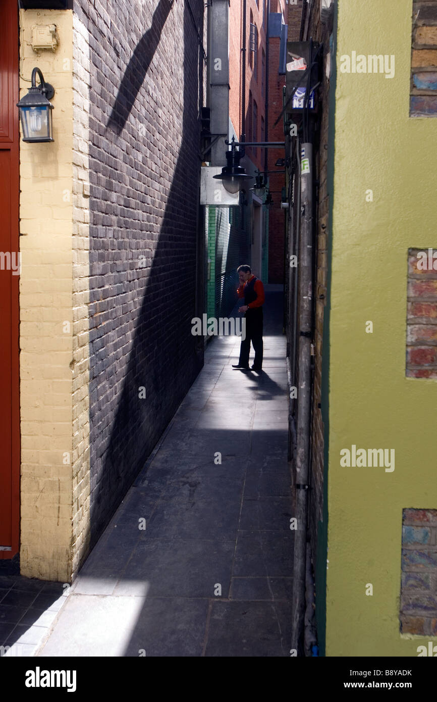a man in soho alleyway in london Stock Photo - Alamy