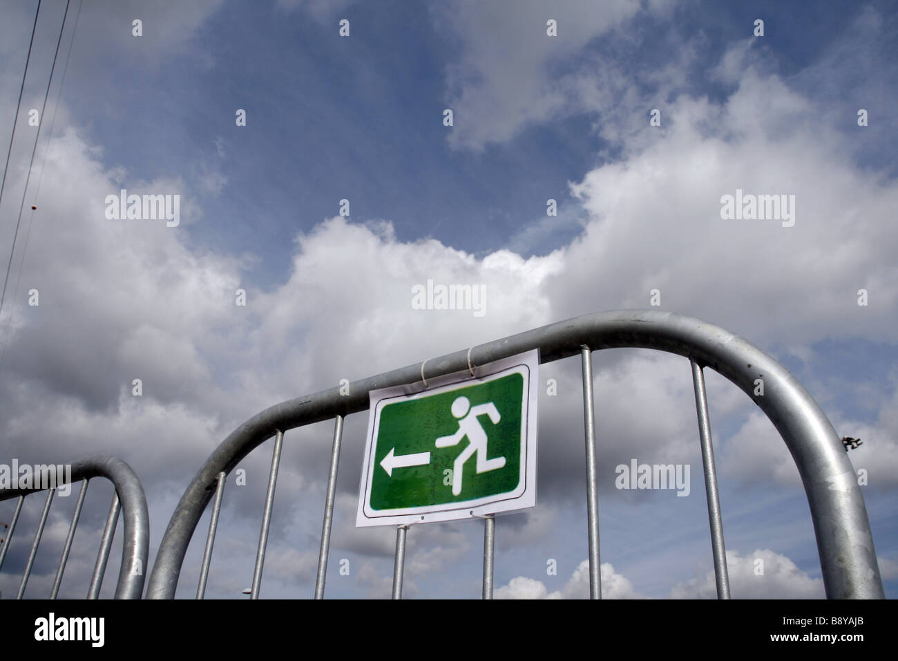 emergency exit sign on barrier fence outdoors Stock Photo - Alamy