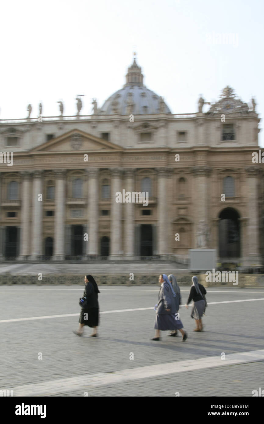 three nuns walking in st peter's square in rome Stock Photo - Alamy