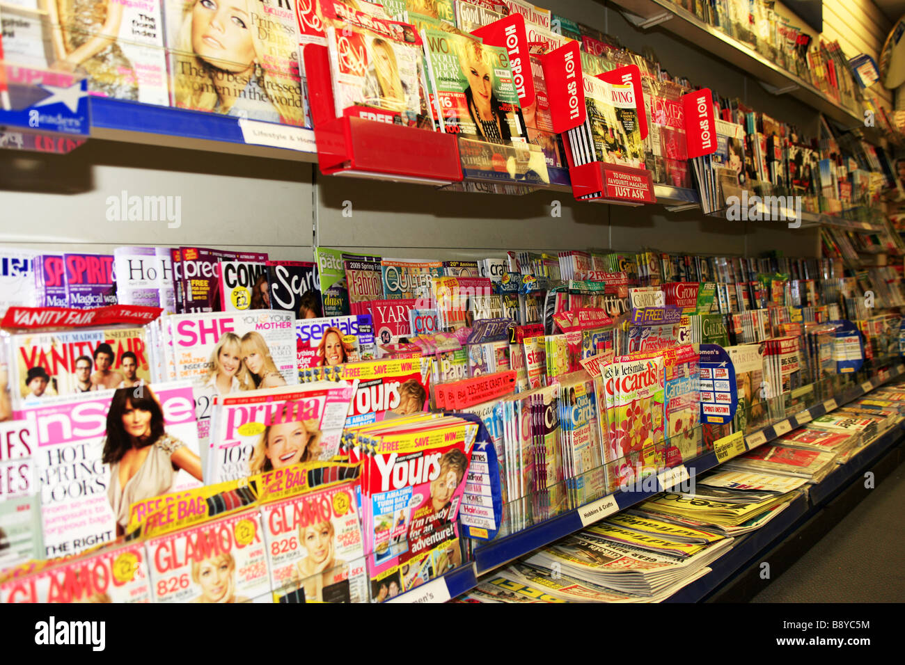 Monthly and weekly Magazines for sale on view at a store Stock Photo ...
