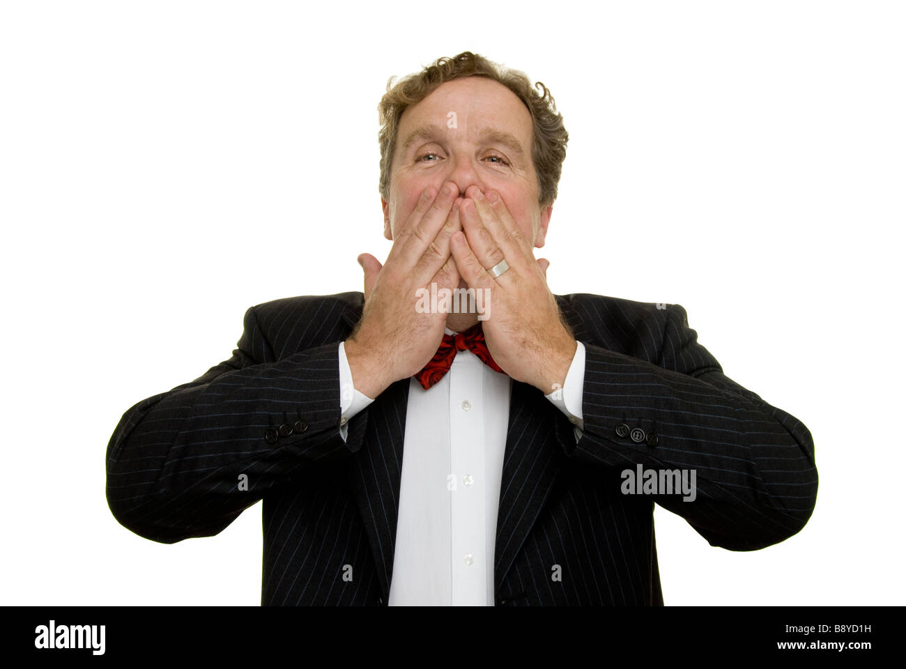 man with hands in front of mouth not speaking Stock Photo - Alamy