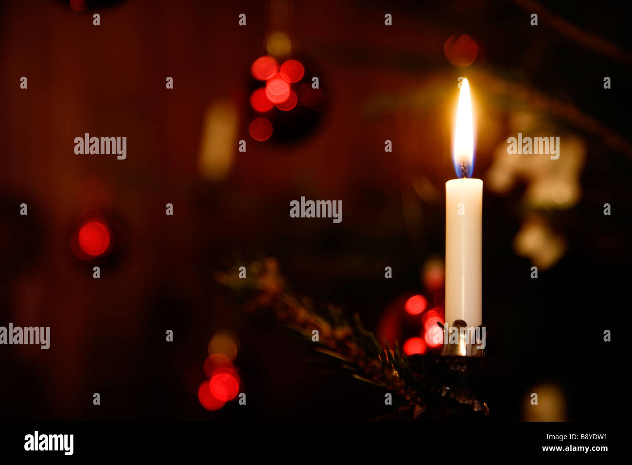 A candle in a Christmas tree close-up Stock Photo - Alamy