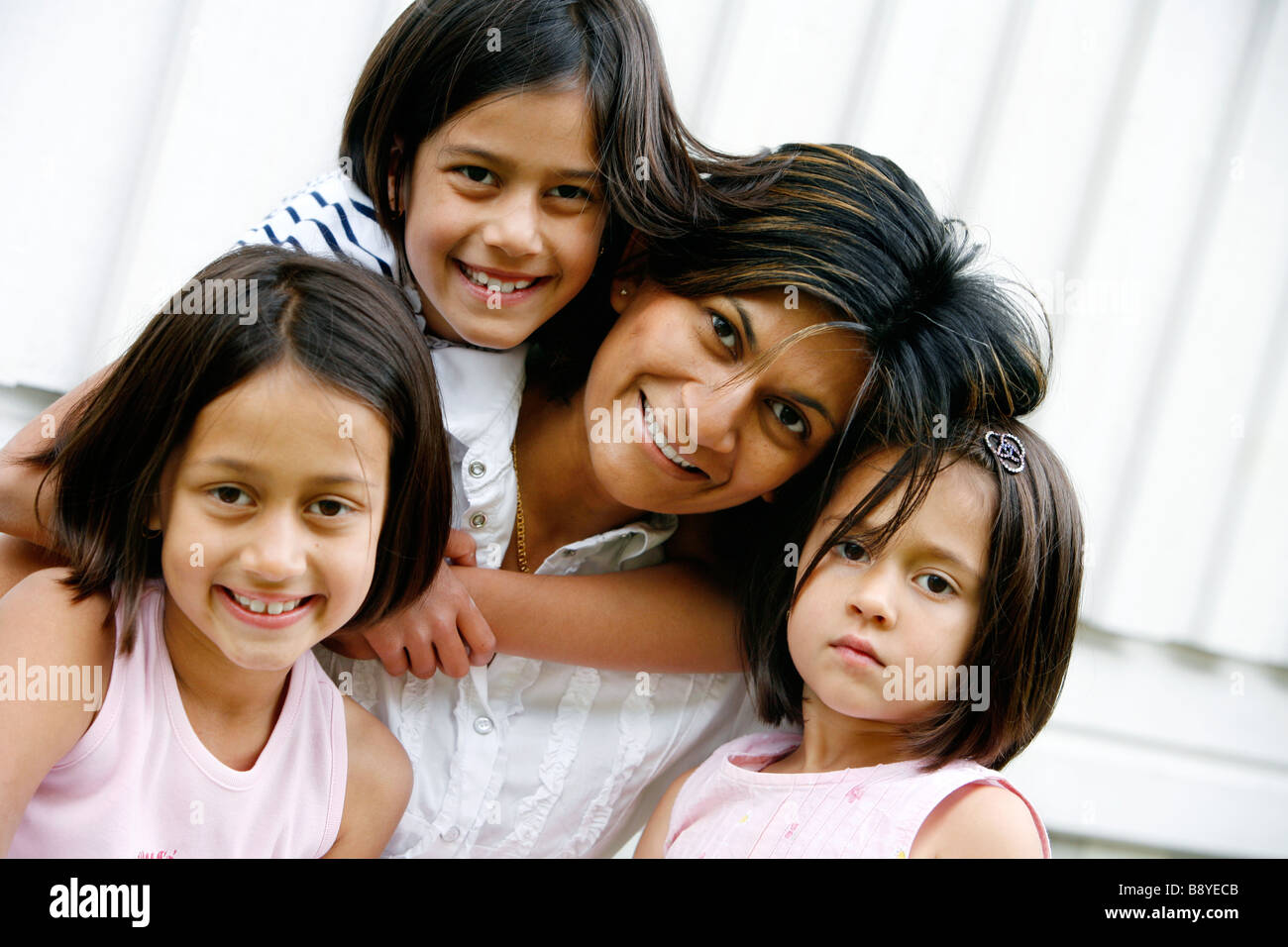 A mother with three daughters Stock Photo - Alamy