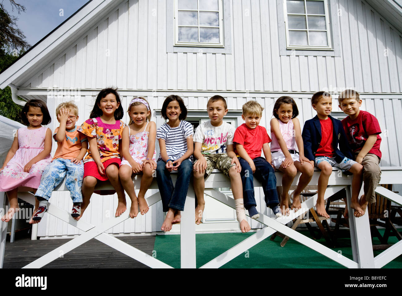 Children seated in front hi-res stock photography and images - Alamy