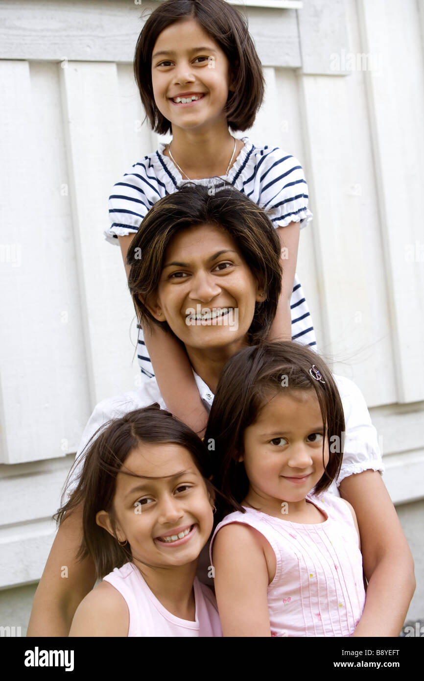 A mother with three daughters Stock Photo - Alamy
