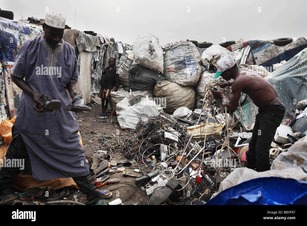 People living as scavenger sort out waste at the Olusosum dump site in ...