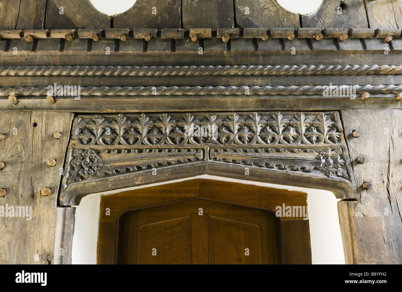 C16th carved door head in the Screens Passage at Rufford Old Hall ...