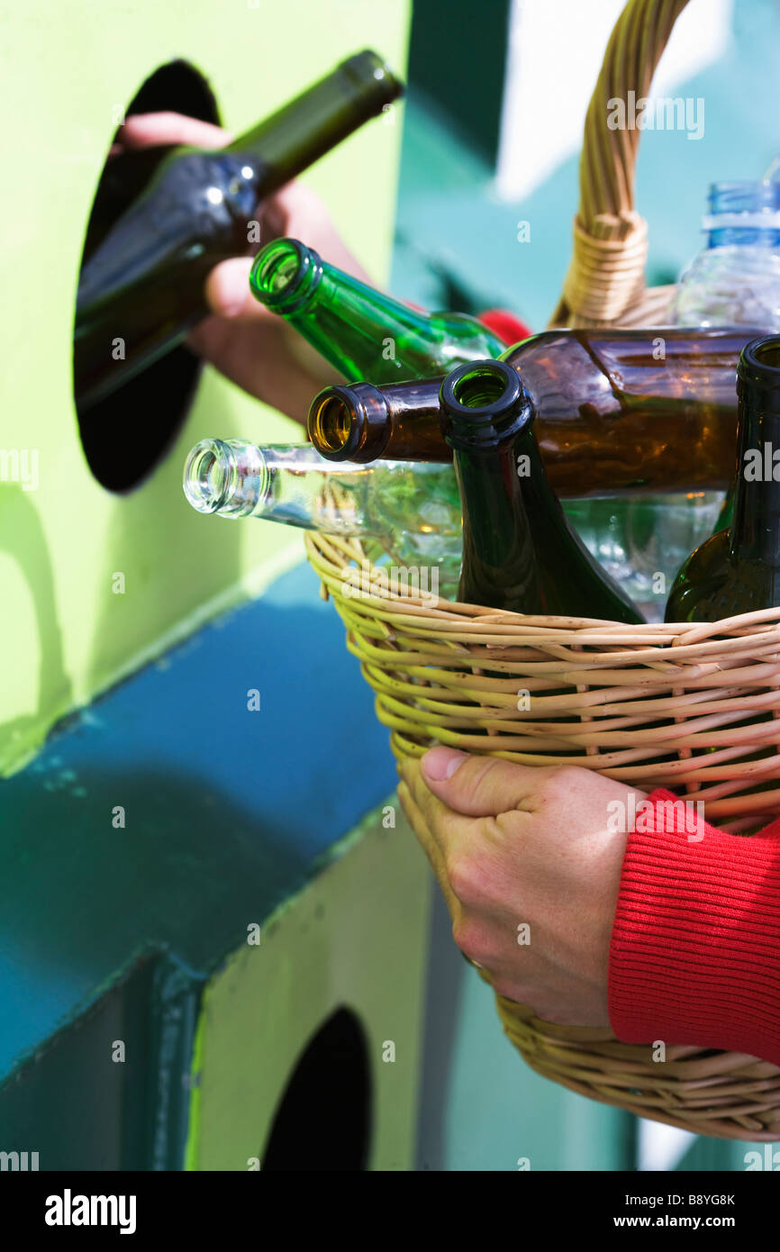 Recycling a bottle of glass close-up Stock Photo - Alamy