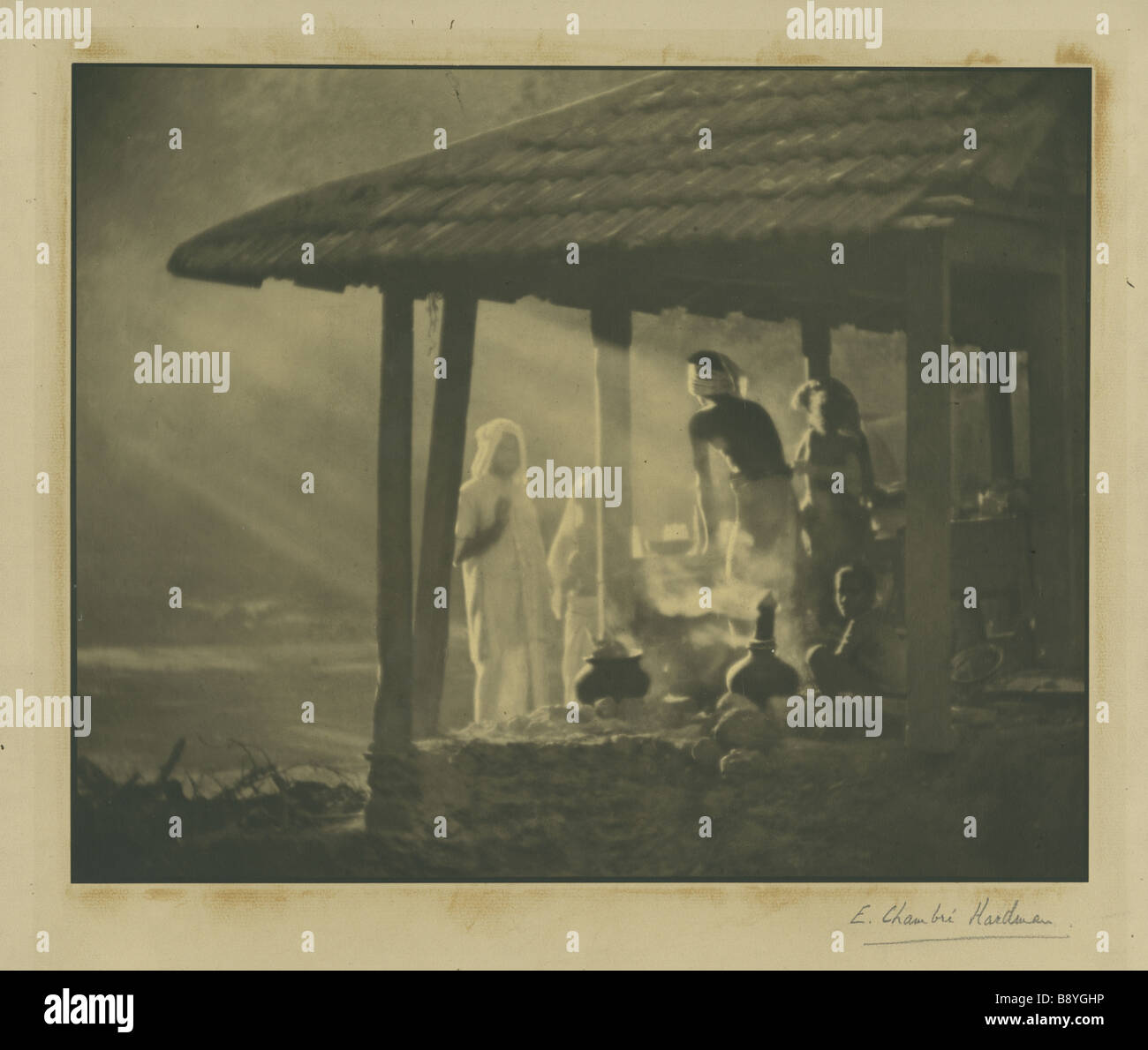 A photograph by E Chambré Hardman of a village scene at Pandikkad in ...