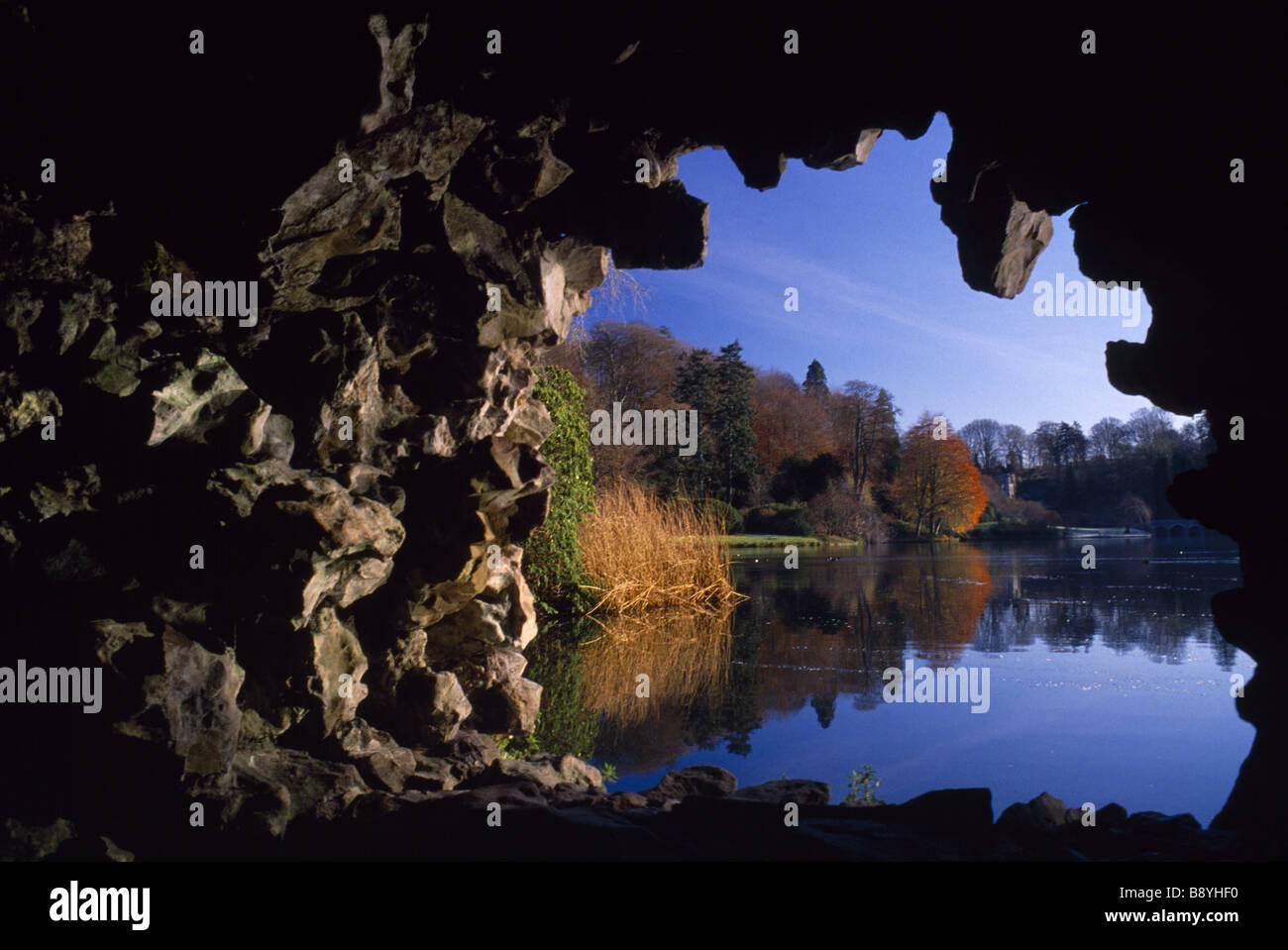 The grotto at Stourhead with autumnal trees blue skies Stock Photo - Alamy