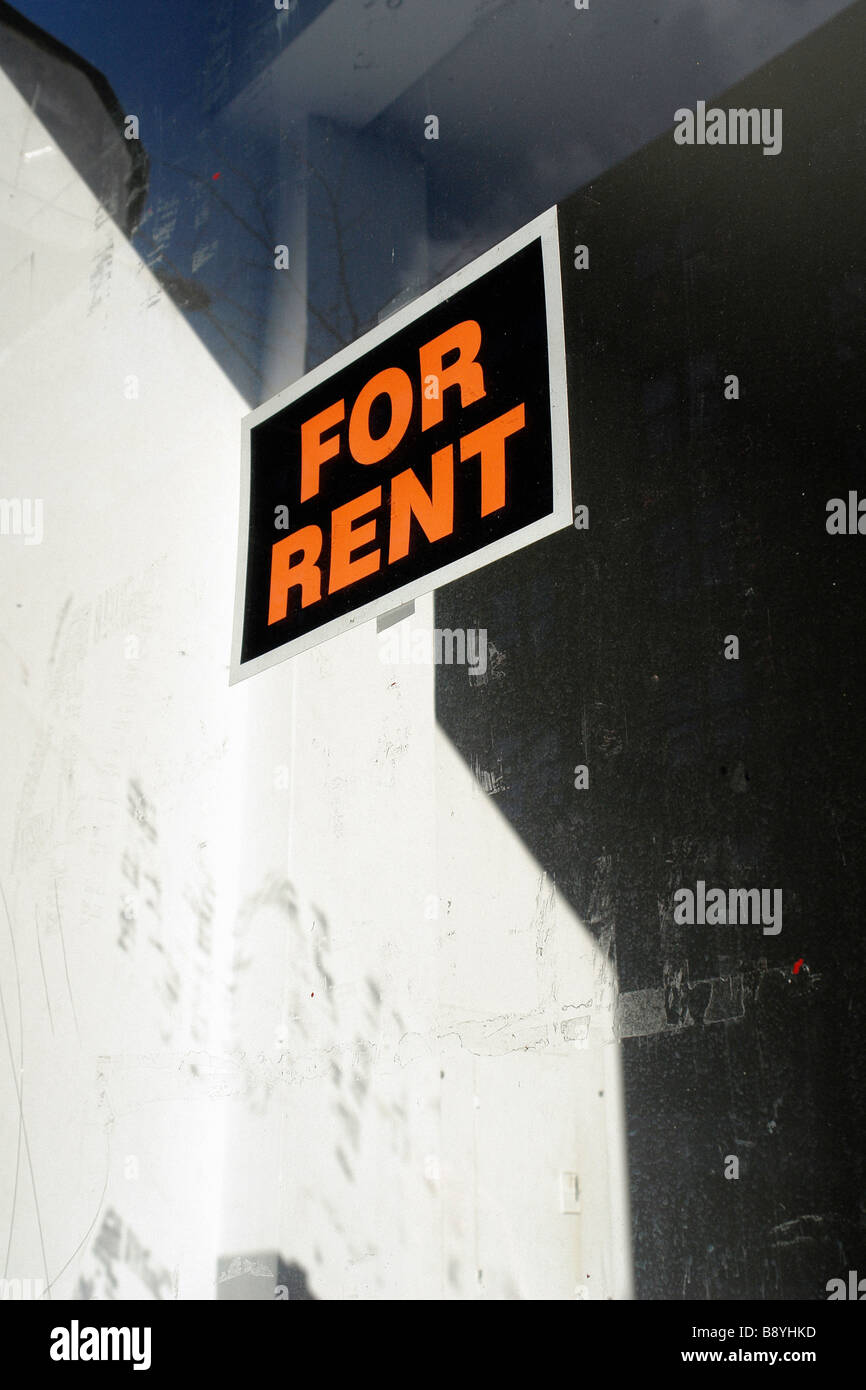 Urban Scene of a "For Rent" Sign on the Window of an Empty Store Front ...