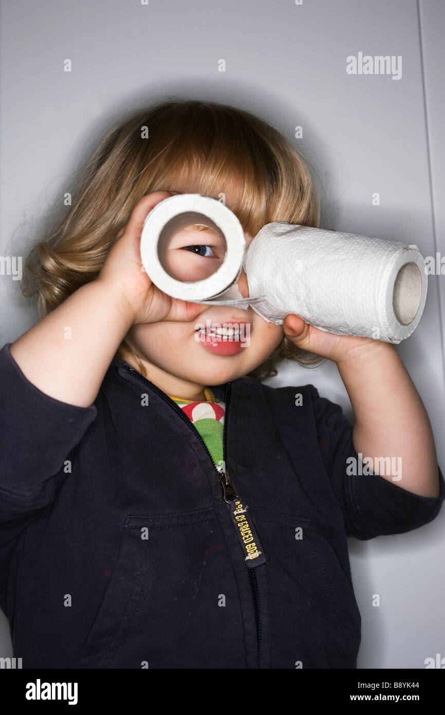 A girl playing with rolls of paper Sweden Stock Photo - Alamy