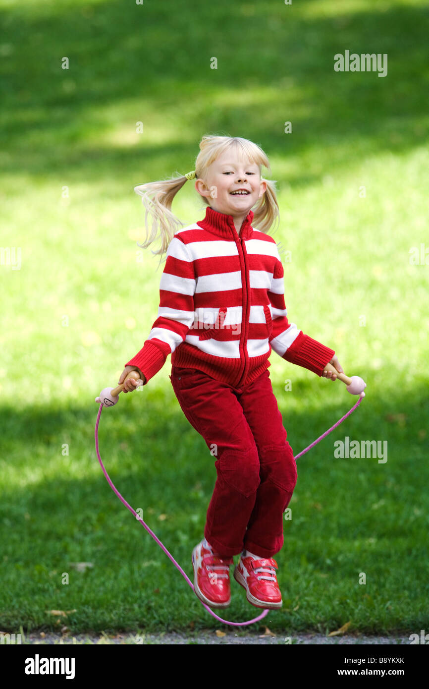 Children playing skipping rope in hi-res stock photography and images ...