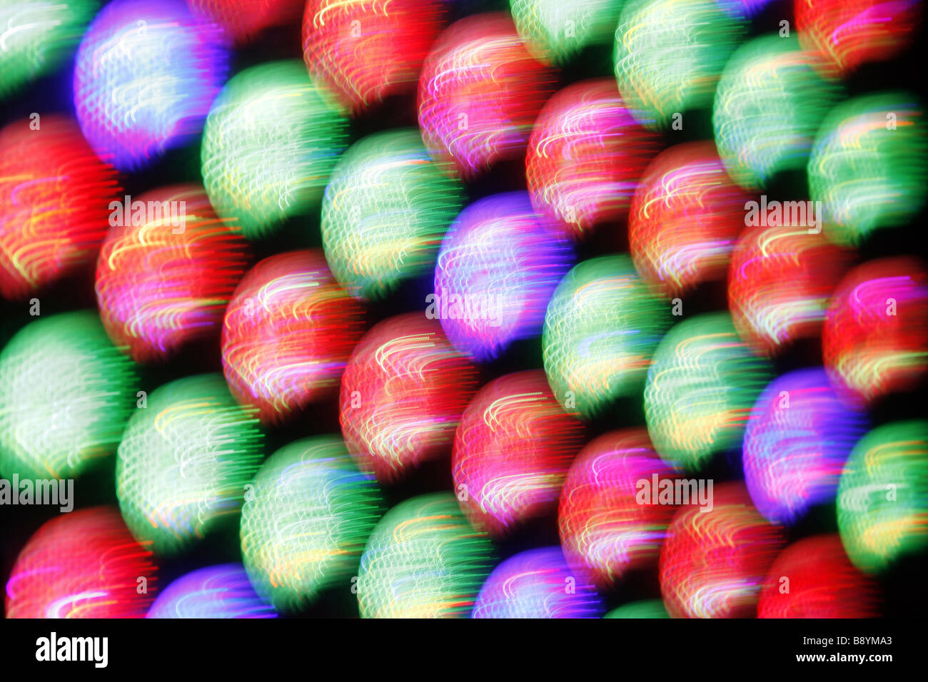 abstract row of many multicoloured flashing colourful fairy lights ...