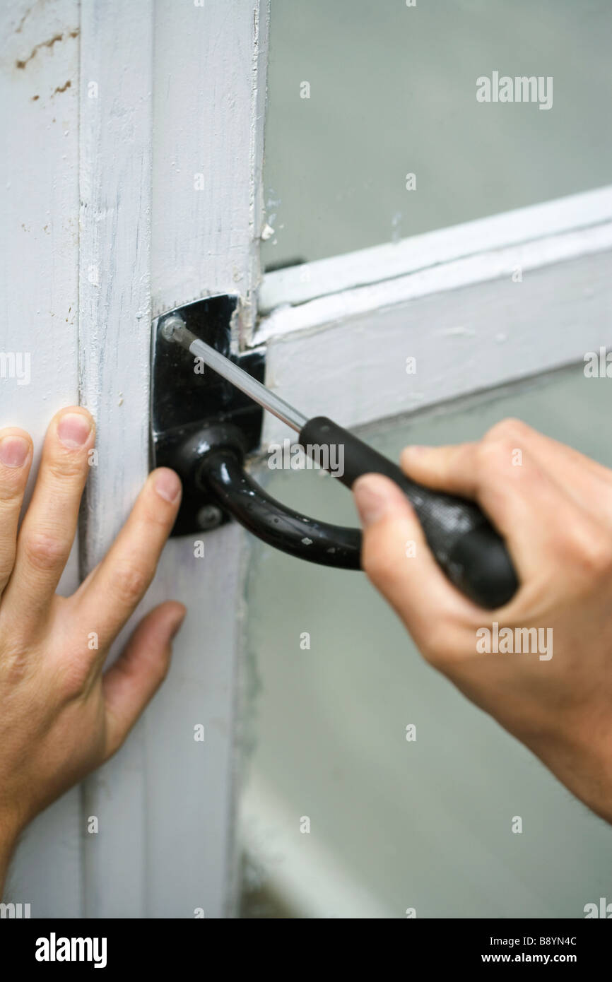 A man using a screwdriver Sweden Stock Photo - Alamy
