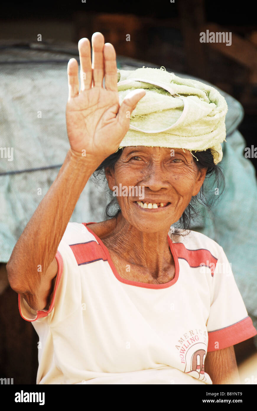 Balinese old lady waving hand hi-res stock photography and images - Alamy