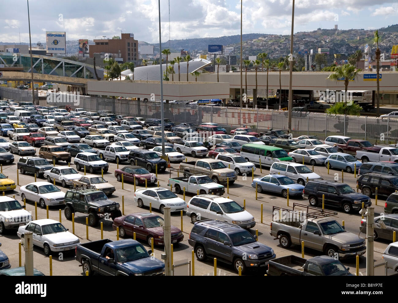 Automobiles wait to enter the U S port of entry at the Tijuana Baja ...
