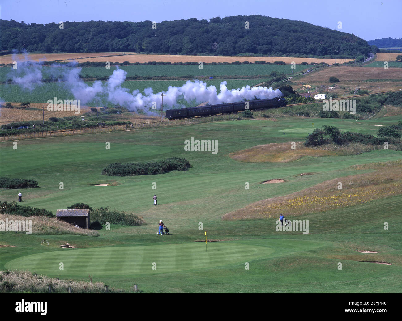 Steam train passing Sheringham golf course on the North Norfolk Railway ...