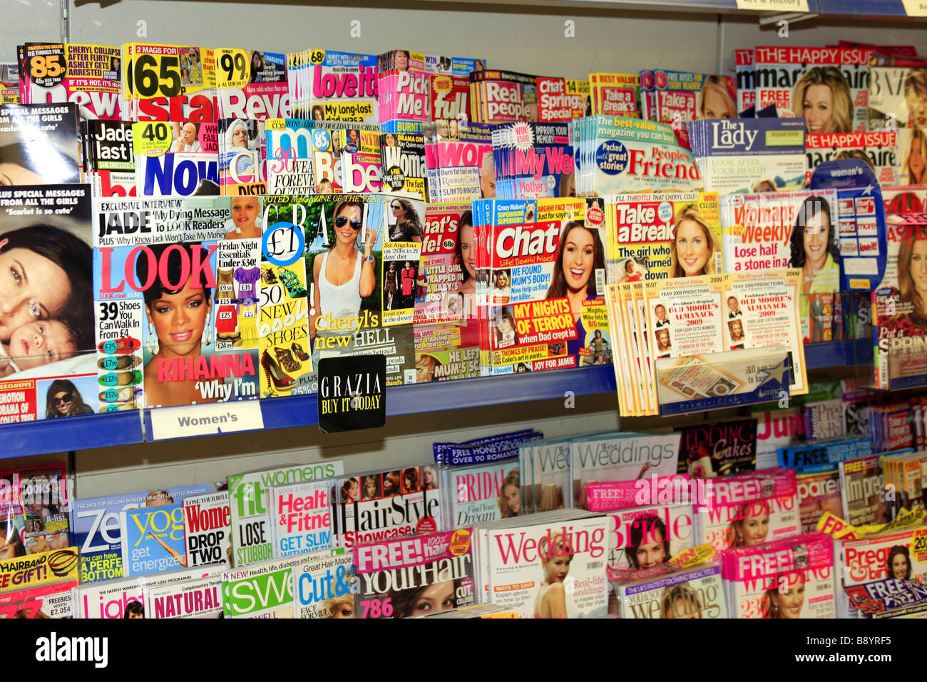 Monthly and weekly Magazines for sale on view at a store Stock Photo ...