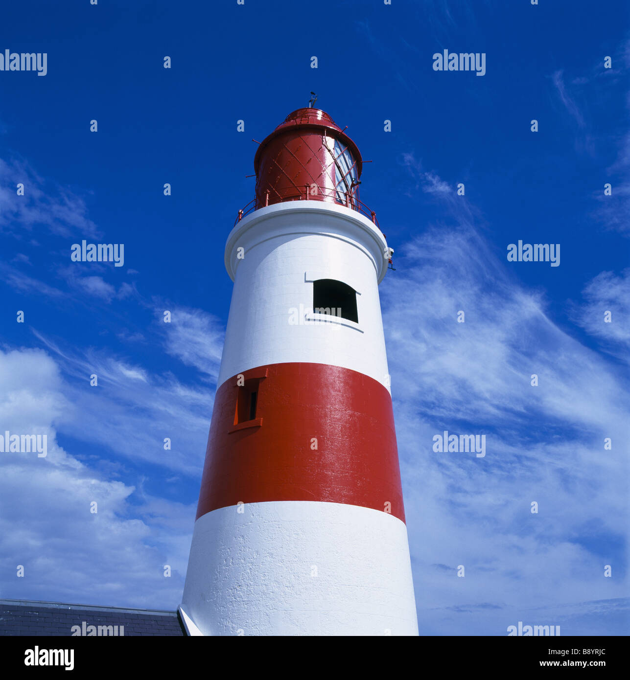 The red and white striped Souter Lighthouse stands out against the blue ...