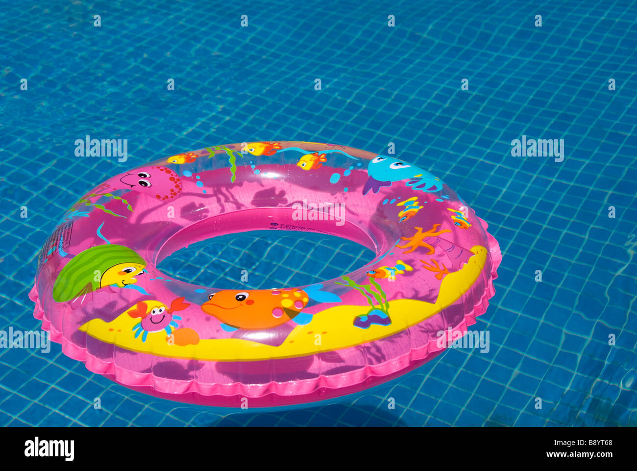 inflatable ring in swimming pool Stock Photo - Alamy