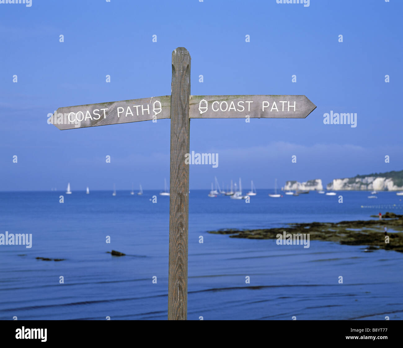 South west coast path signpost at Middle beach with Old Harry Rocks NT ...